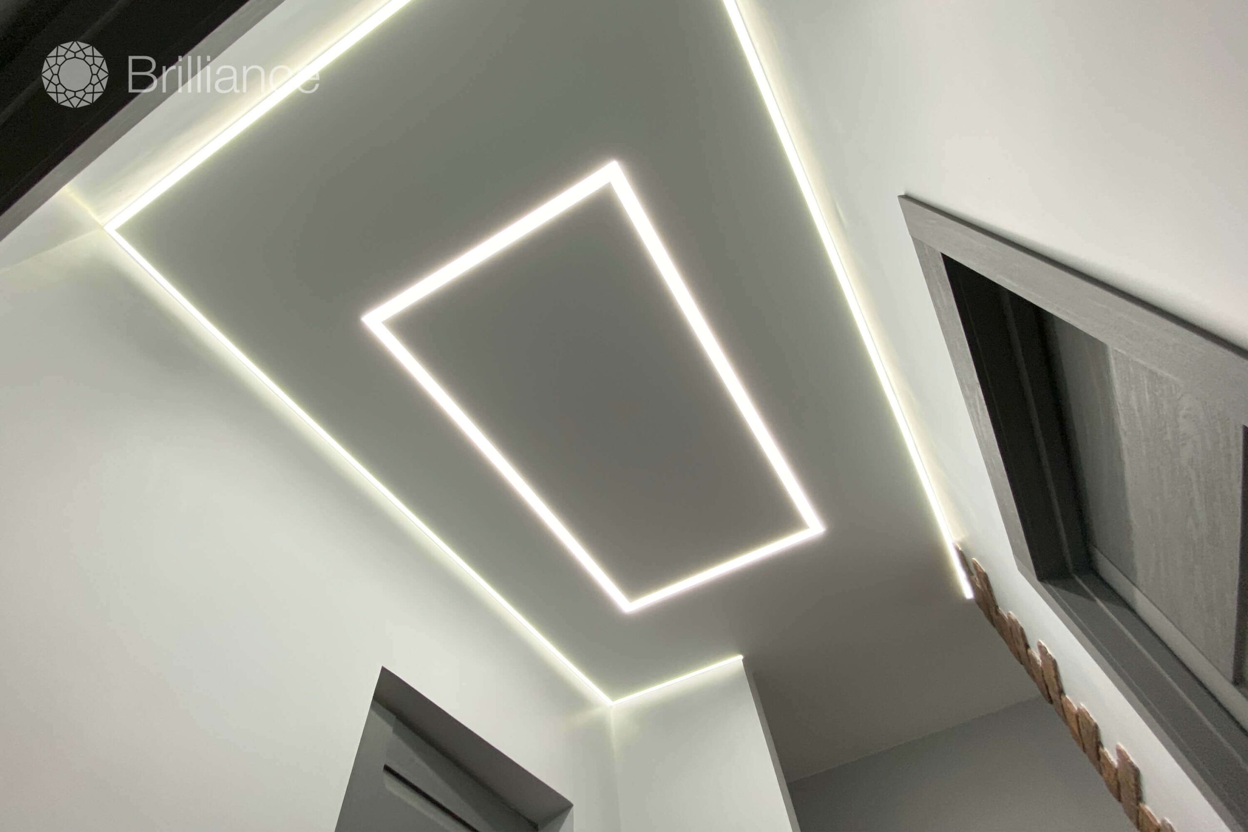 Stretch ceiling in the hallway with LED lines and a floating profile ...